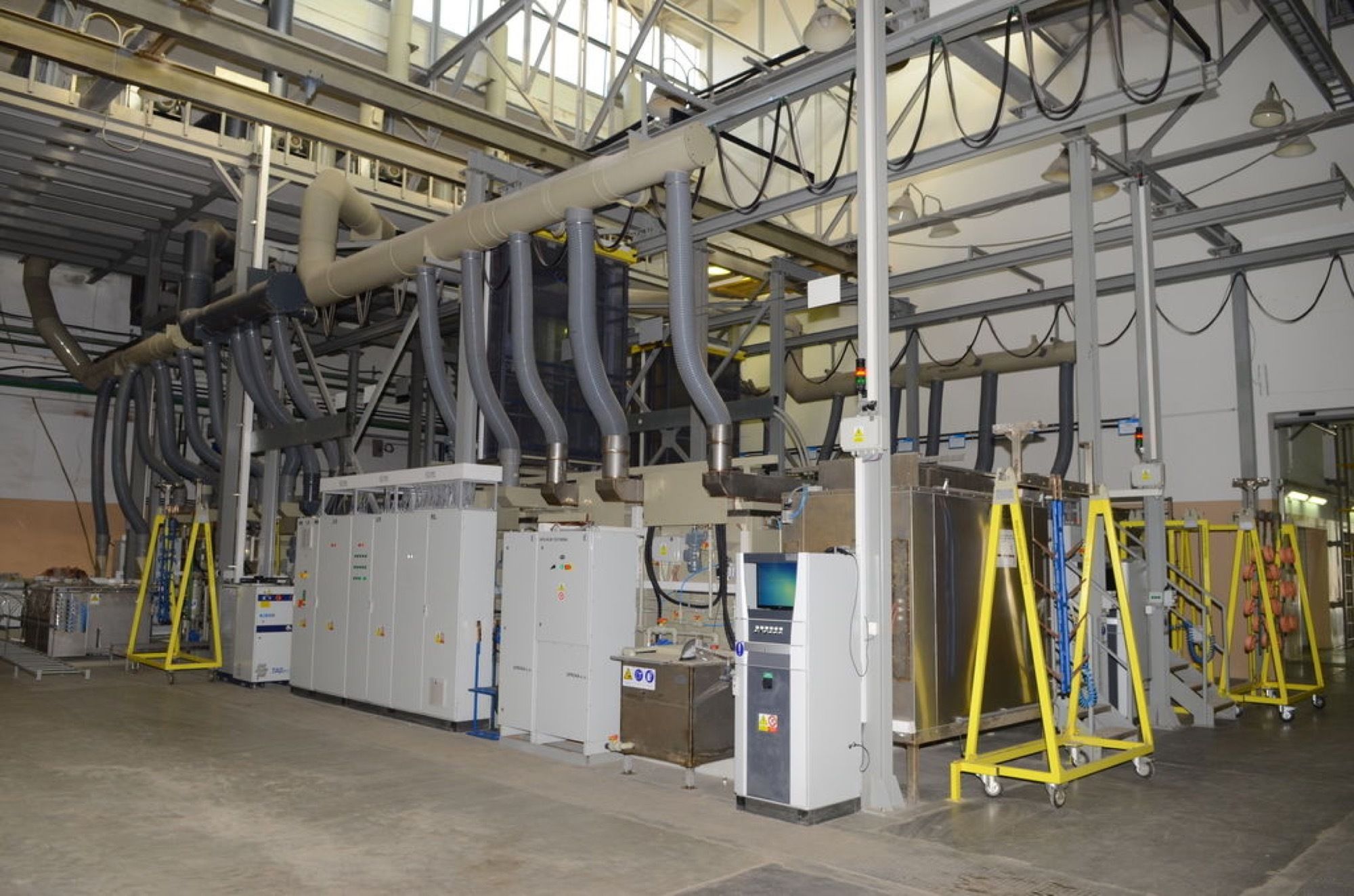 Automatic single-row line for galvanic copper plating on steel hinges.