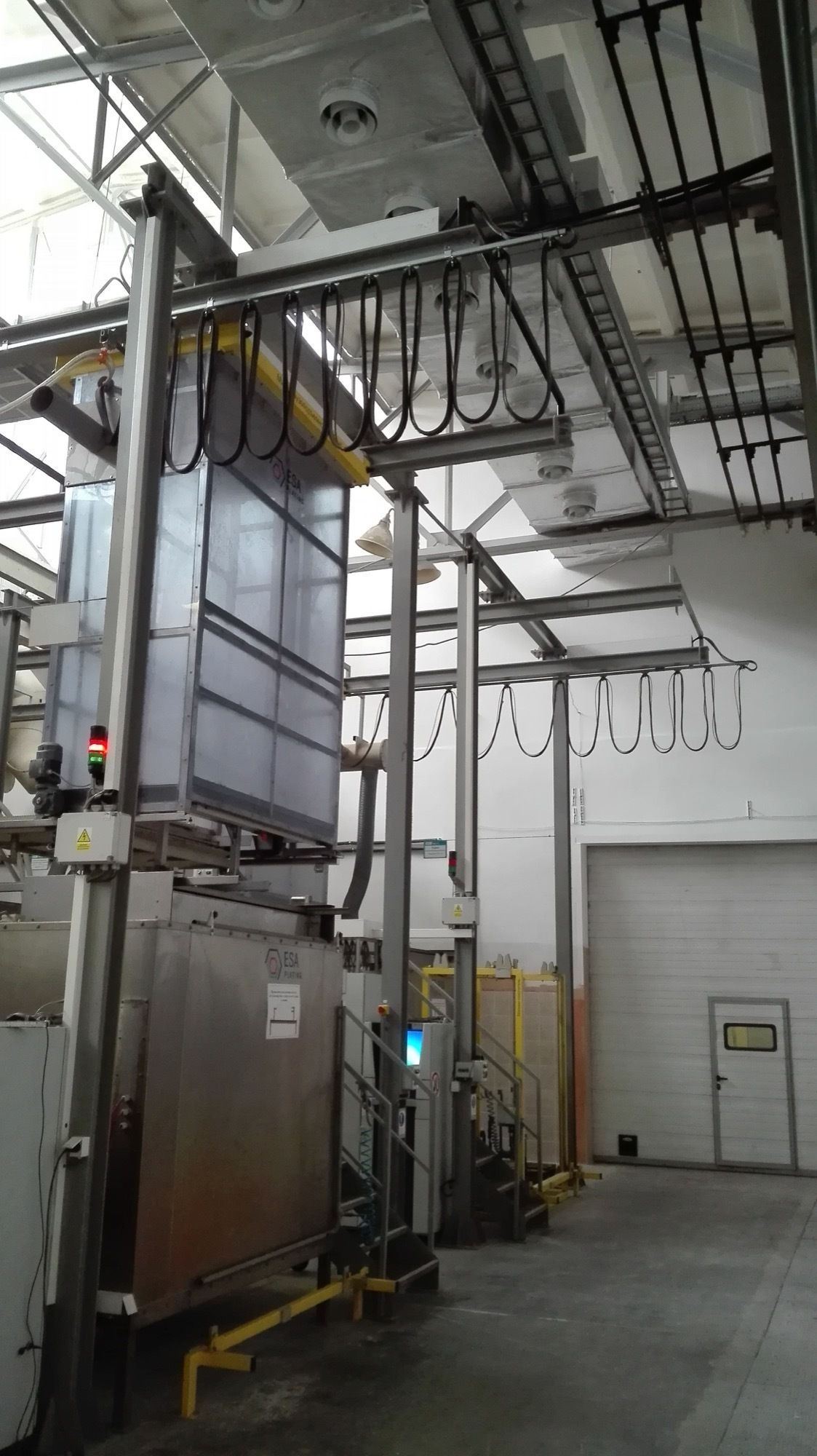 Automatic single-row line for galvanic copper plating on steel hinges.